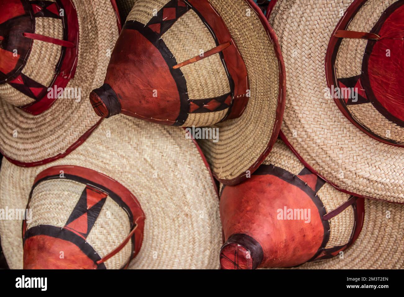 Typical colorful hats of Nigerian Fulani tribe, exposed in touristic ...