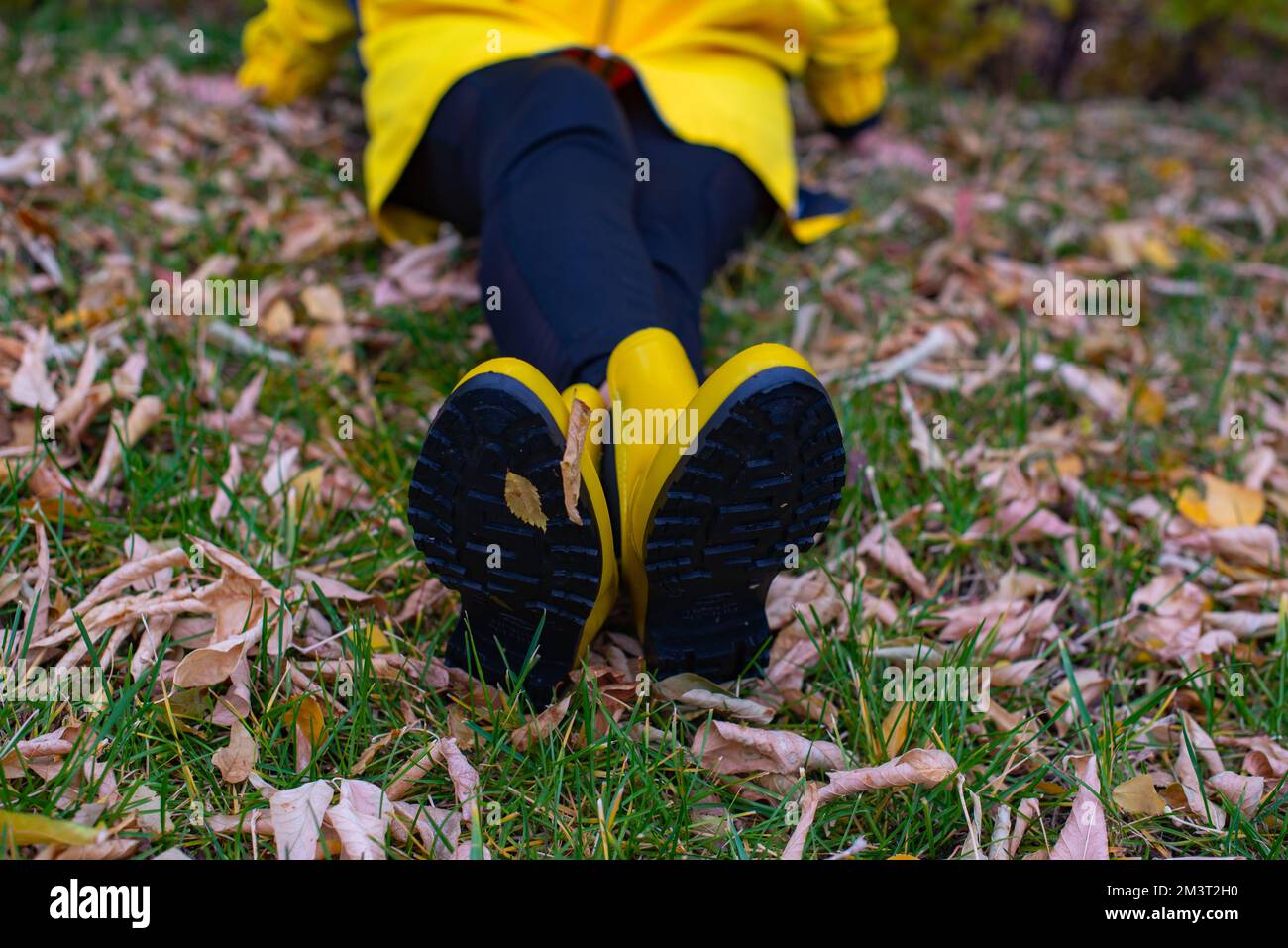 yellow boots on a girl's feet in autumn Stock Photo - Alamy