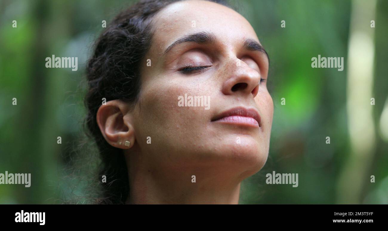 Woman taking deep breath zen hi-res stock photography and images - Alamy