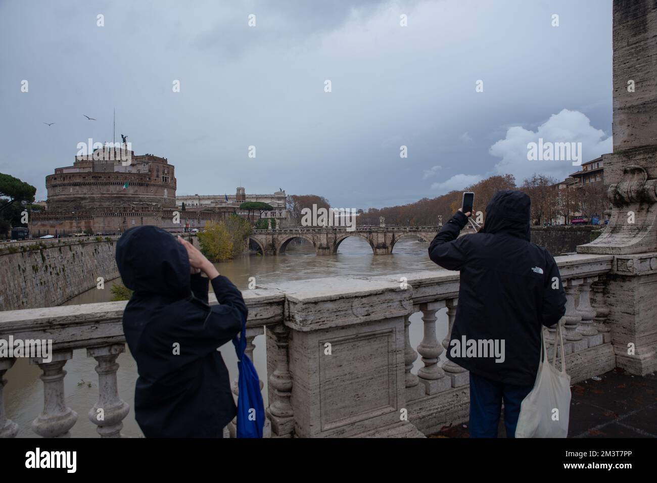 Rome, Italy. 16th Dec, 2022. Some people stop on the bridges to watch ...