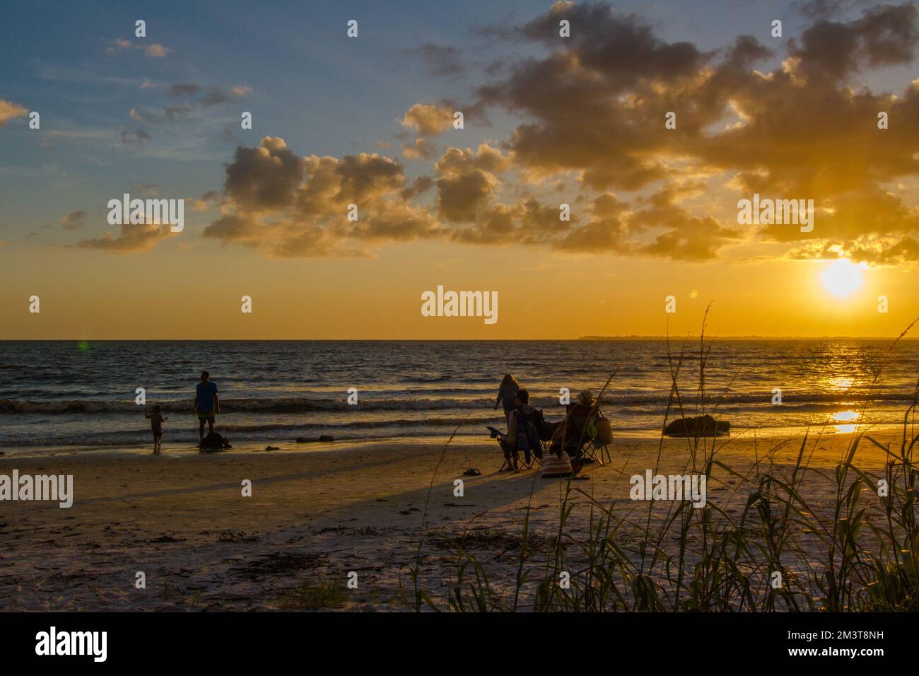 Watching the sun set Stock Photo - Alamy
