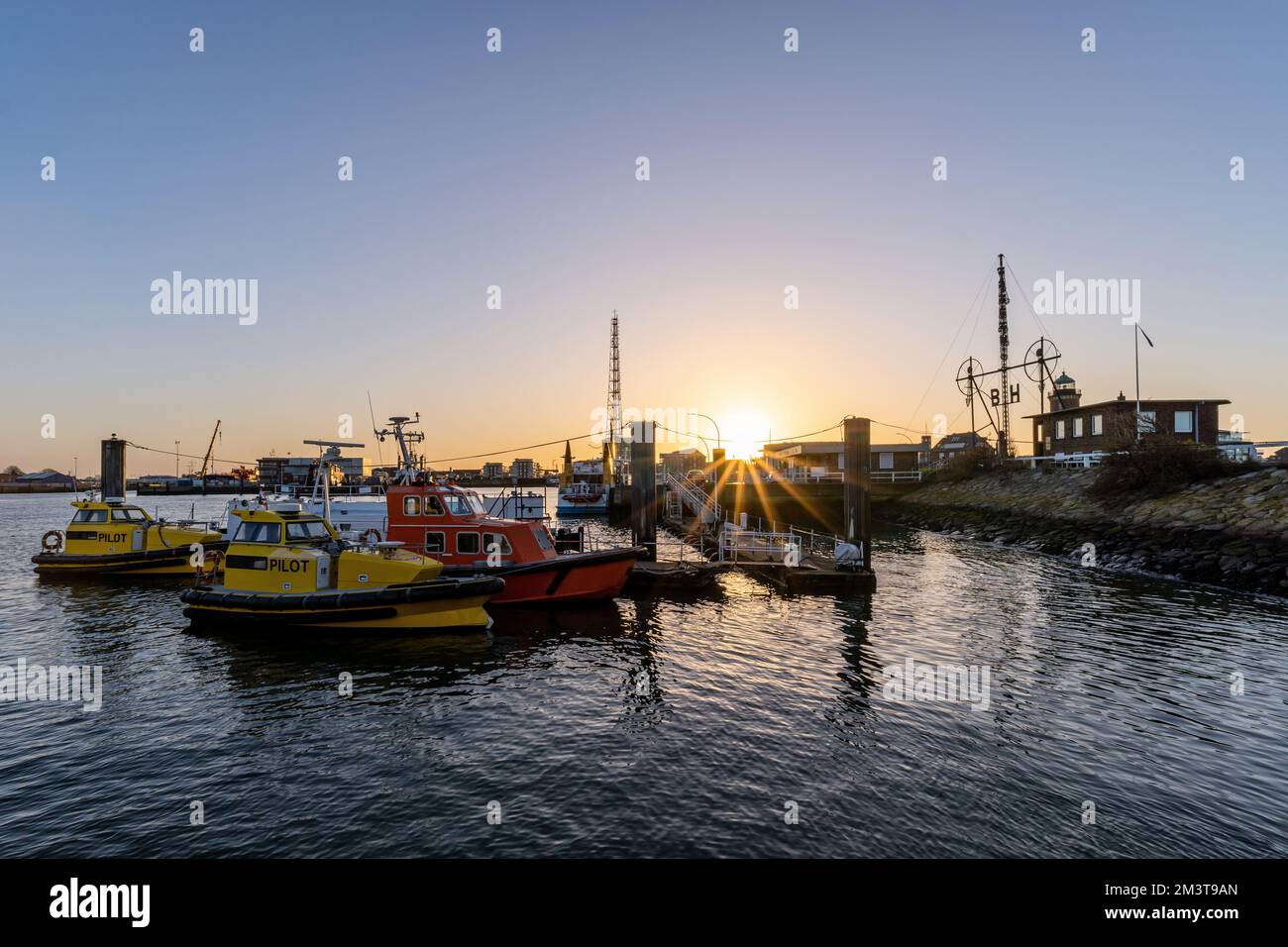 pilot boats in the port of Cuxhaven, Germany at sunset Stock Photo - Alamy