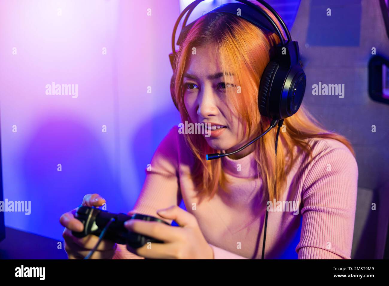 Gamer using joystick controller for virtual tournament plays online ...