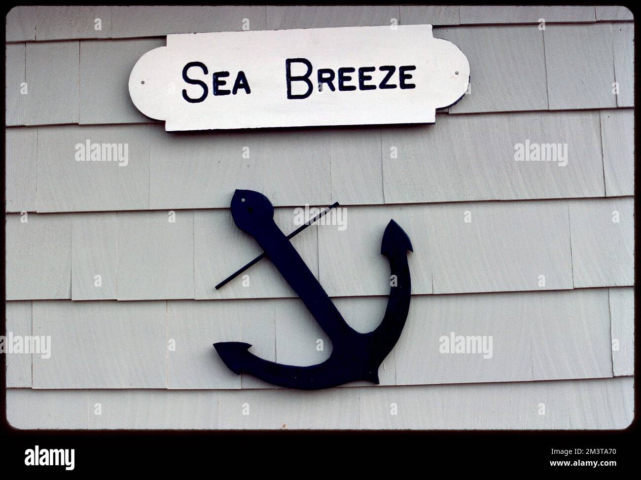 'Sea Breeze' sign and representation of anchor on wall , Signs Notices ...