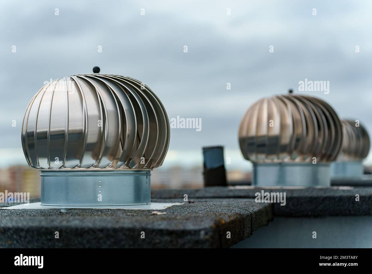Rotary deflectors on the apartment house rooftop Stock Photo - Alamy