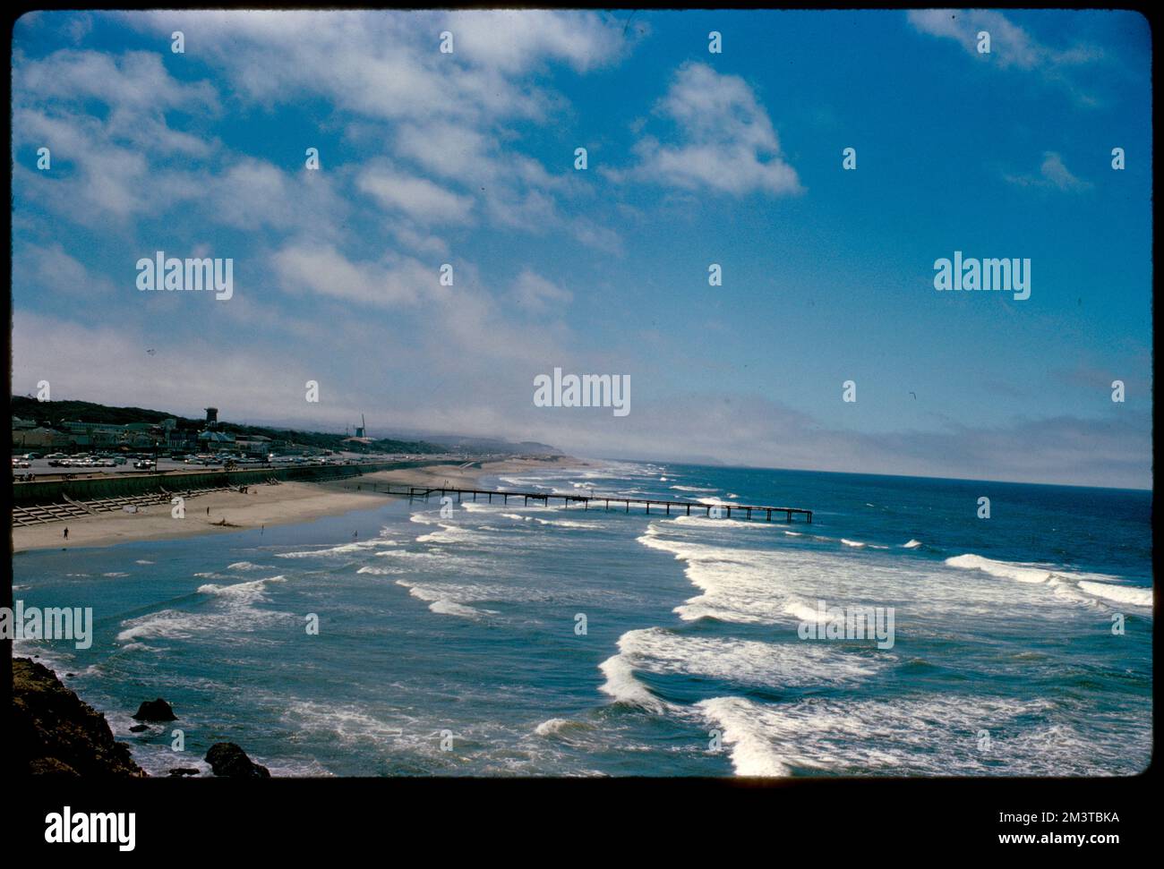 Seawall and shore along ocean with pier, Ocean Beach, San Francisco ...