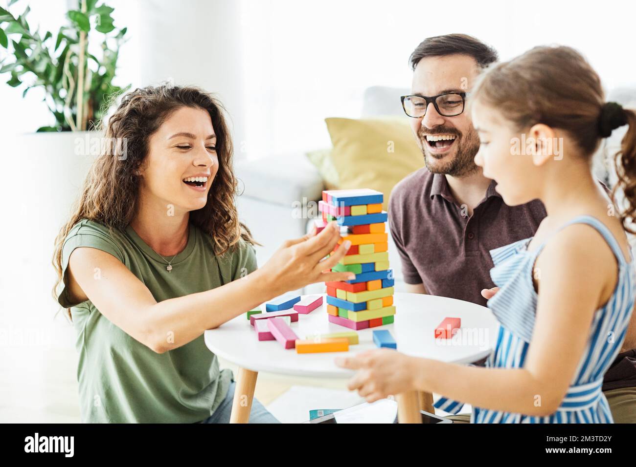 child daughter family happy mother father board game palying playing ...