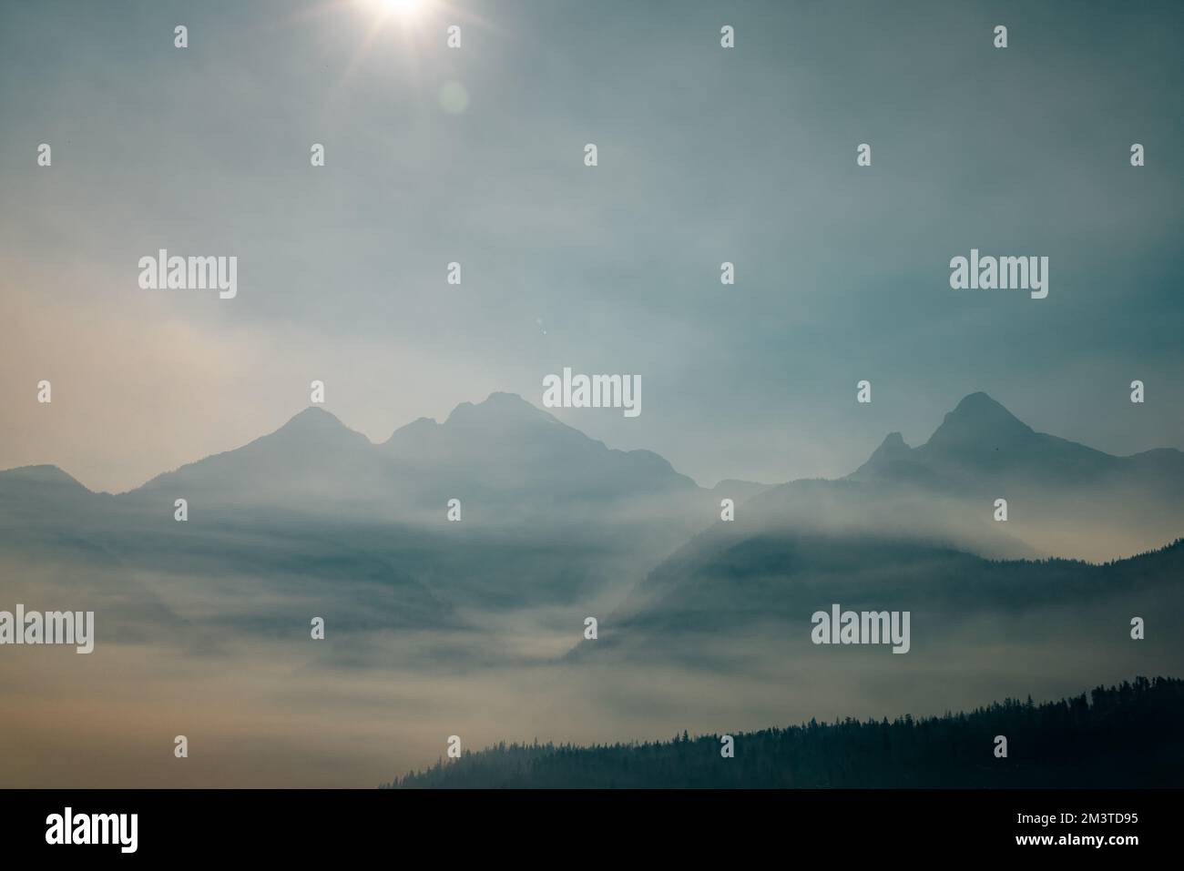 Smoke from nearby wild fires settle at diablo lake in North Cascades ...