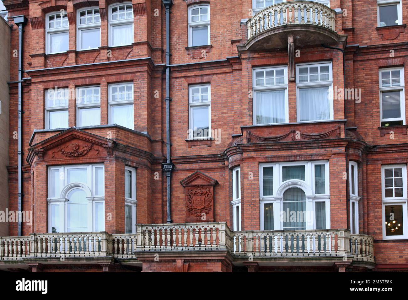 Old apartment building with ornate balconies in the Mayfair area of ...