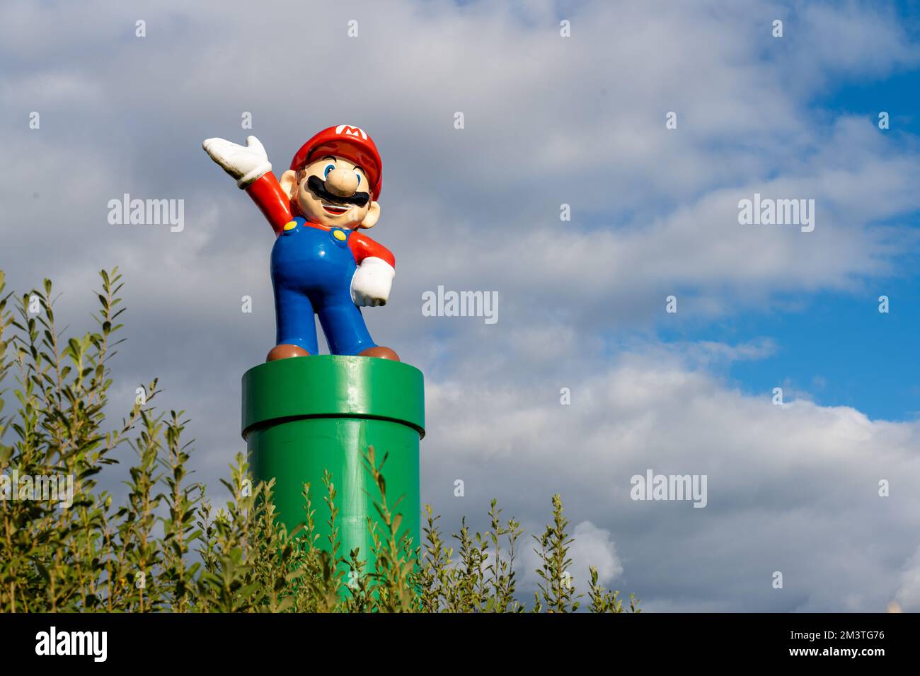 Kungsbacka, Sweden - september 11 2022: Mario statue on top of a green ...
