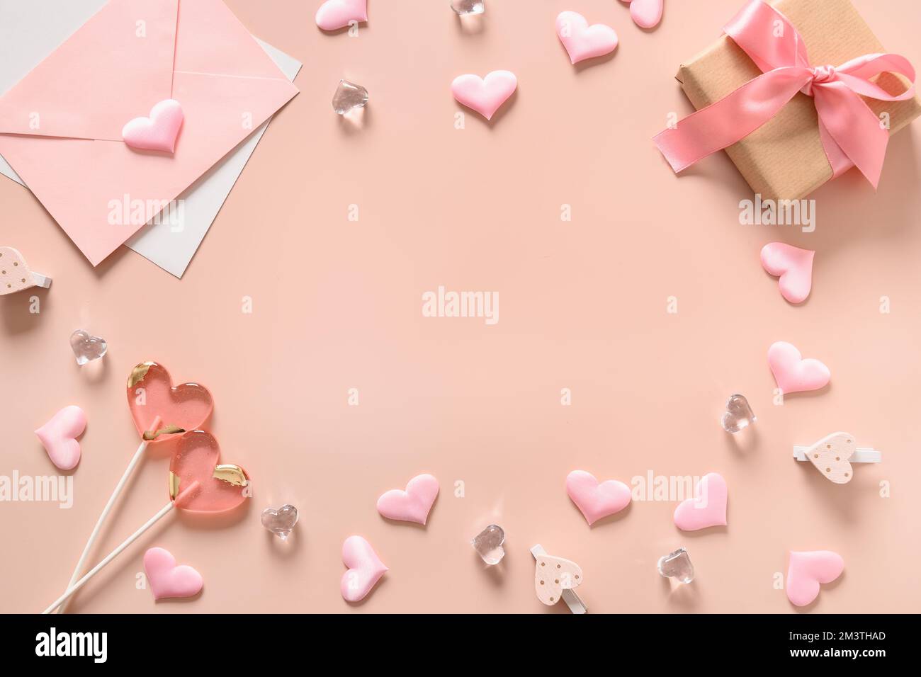 Valentine's day frame with pink lollipops, pink envelope, gift and ...