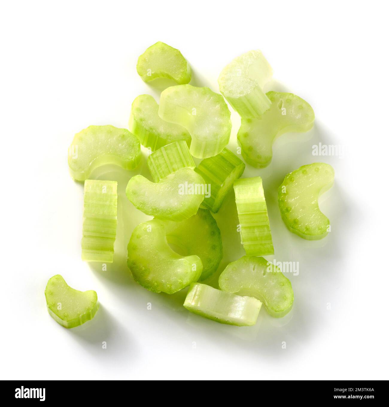 raw sliced celery isolated on white background, top view Stock Photo - Alamy