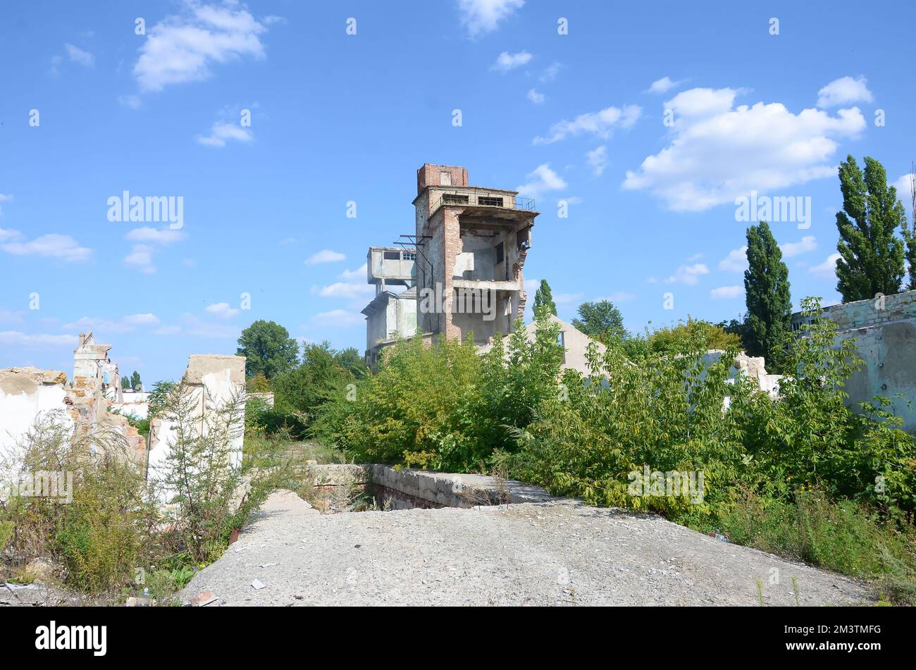 Collapsed industrial multistorey building in daytime. Disaster scene ...