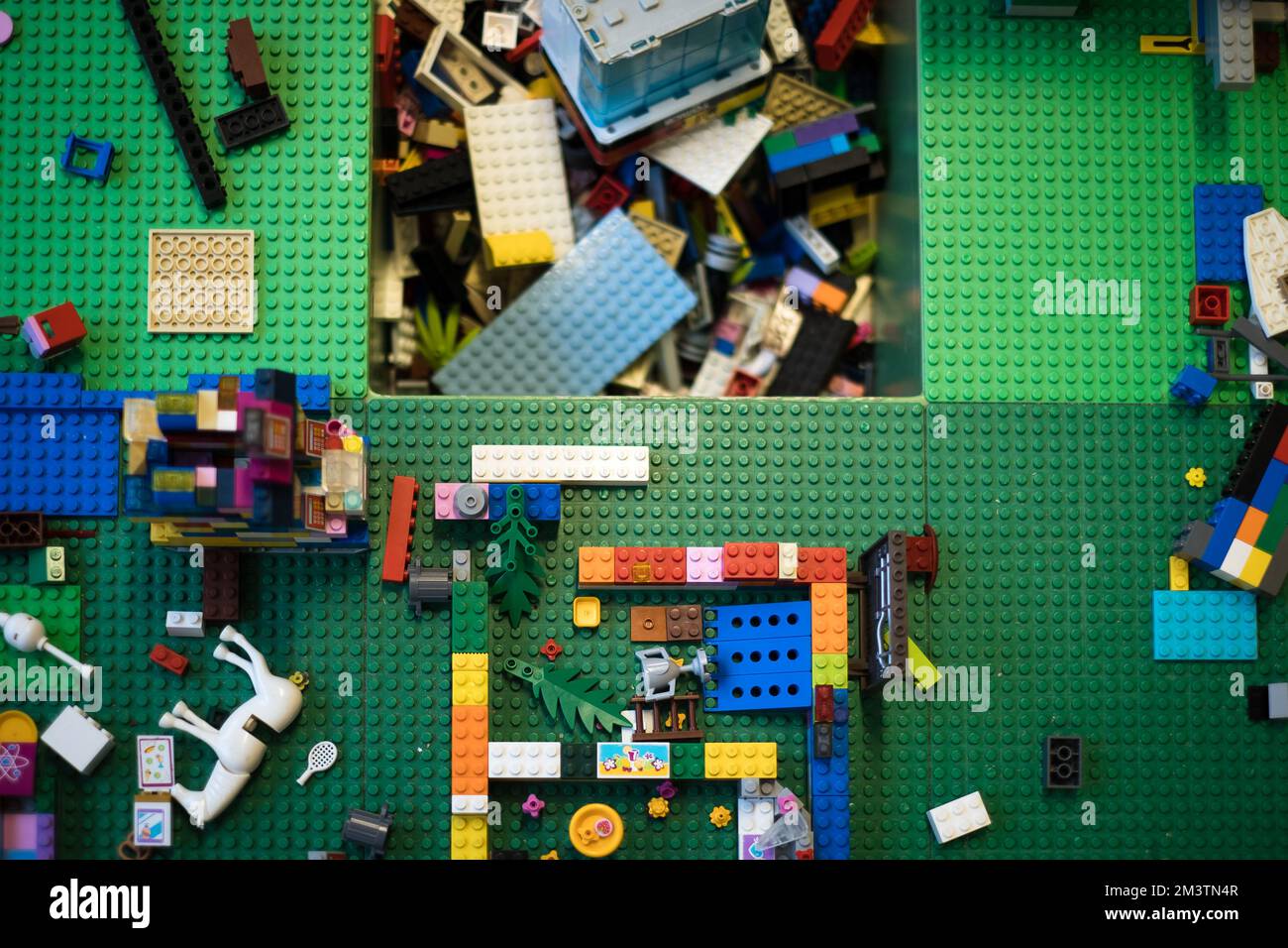 Multicolored plastic kids building blocks table Stock Photo - Alamy