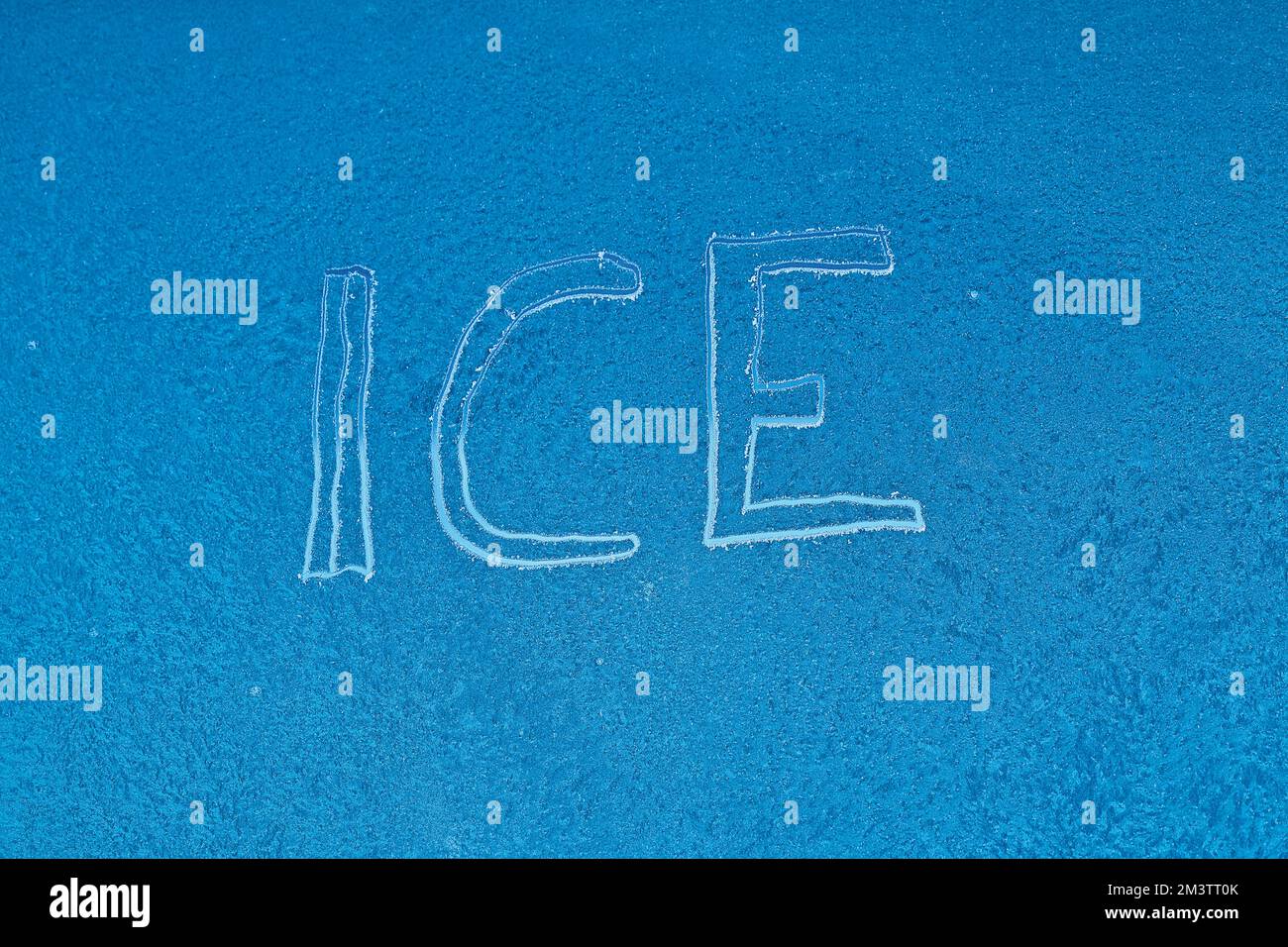 The word 'ICE' etched onto a frozen windscreen during subzero ...