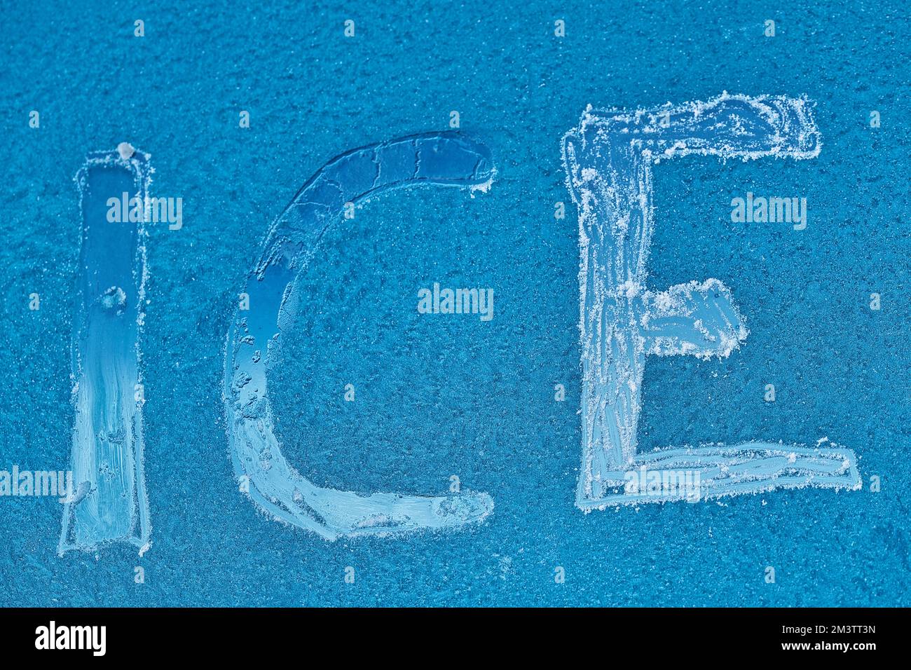 The word 'ICE' etched onto a frozen windscreen during subzero ...