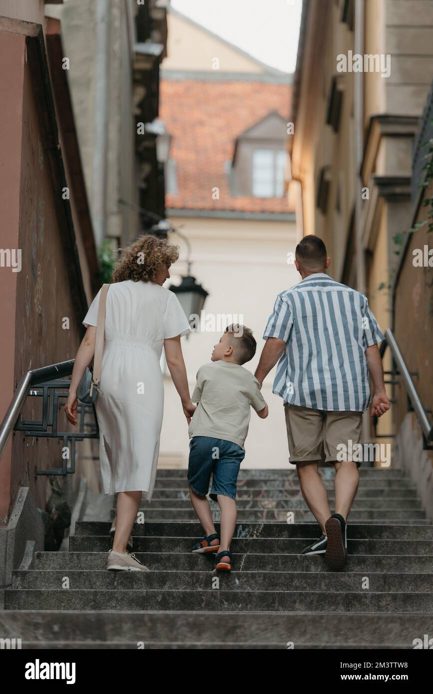 Family is climbing stairs in an old European town Stock Photo - Alamy