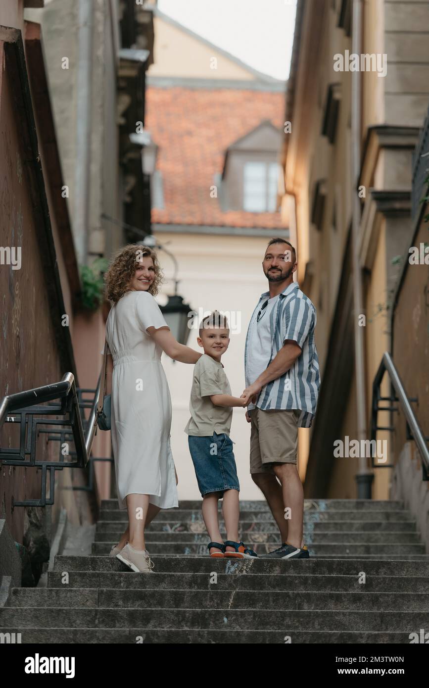 Family is climbing stairs in an old European town Stock Photo - Alamy