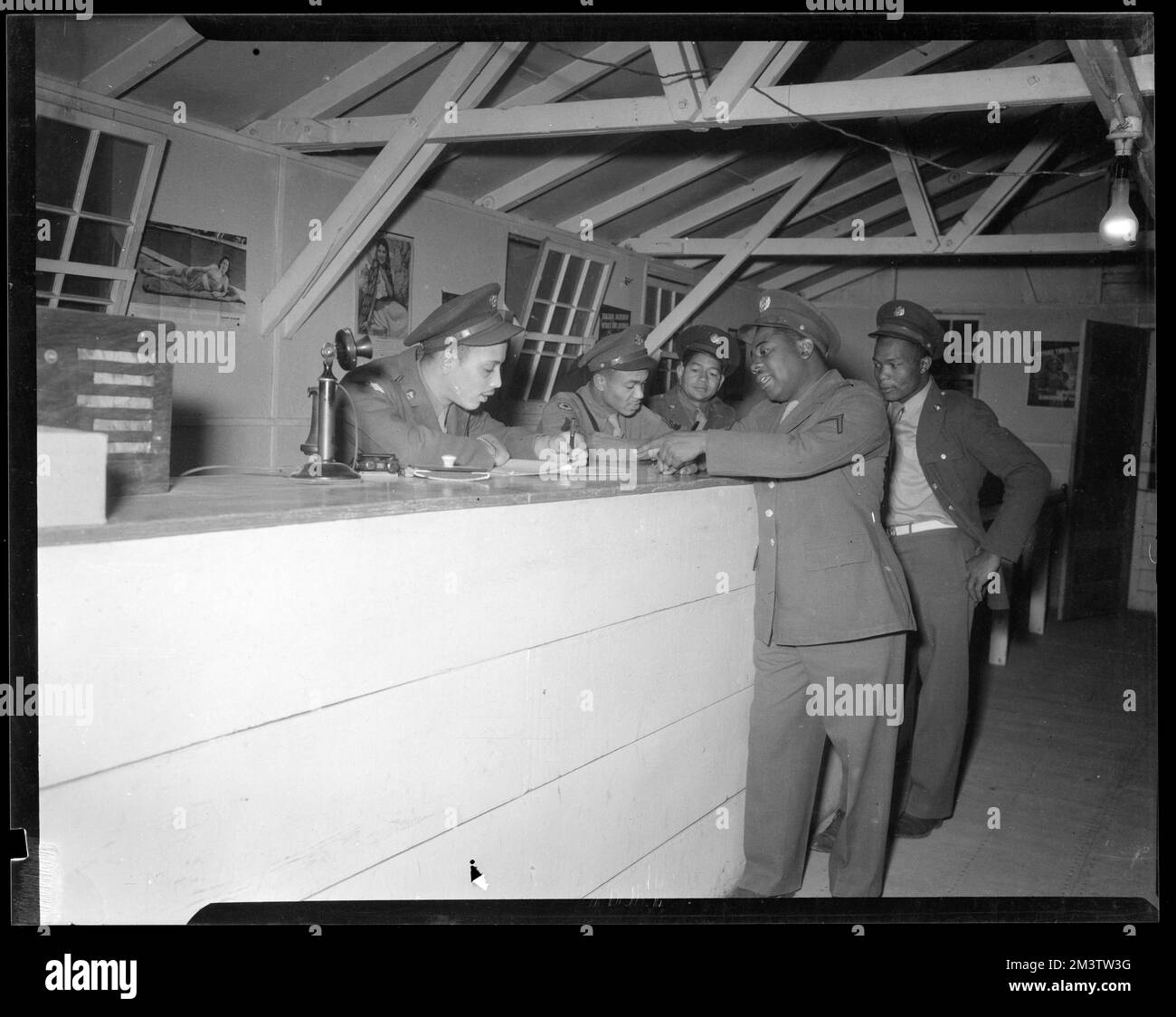 Soldiers at counter with telephone and paperwork , Soldiers. Jack ...