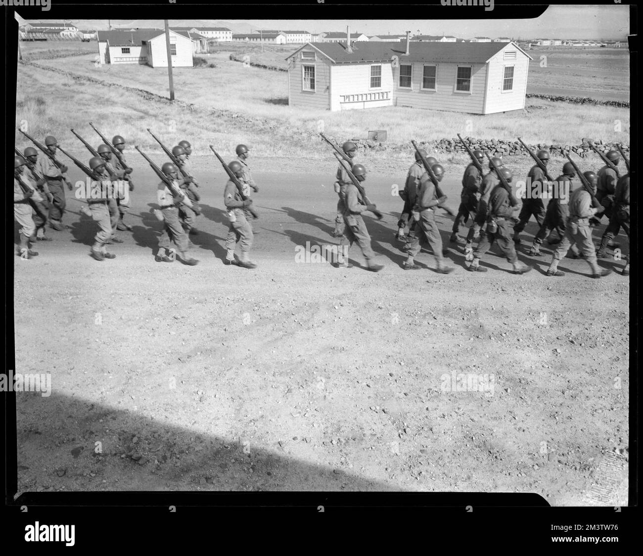 Soldiers marching in formation, buildings in background , Soldiers ...