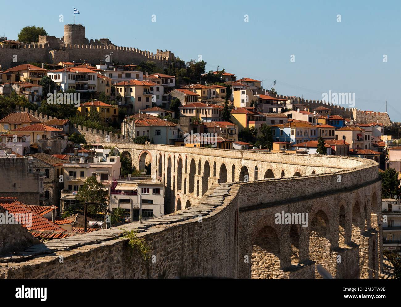 A beautiful view of the city of Kavala in Greece with the Greek flag on ...