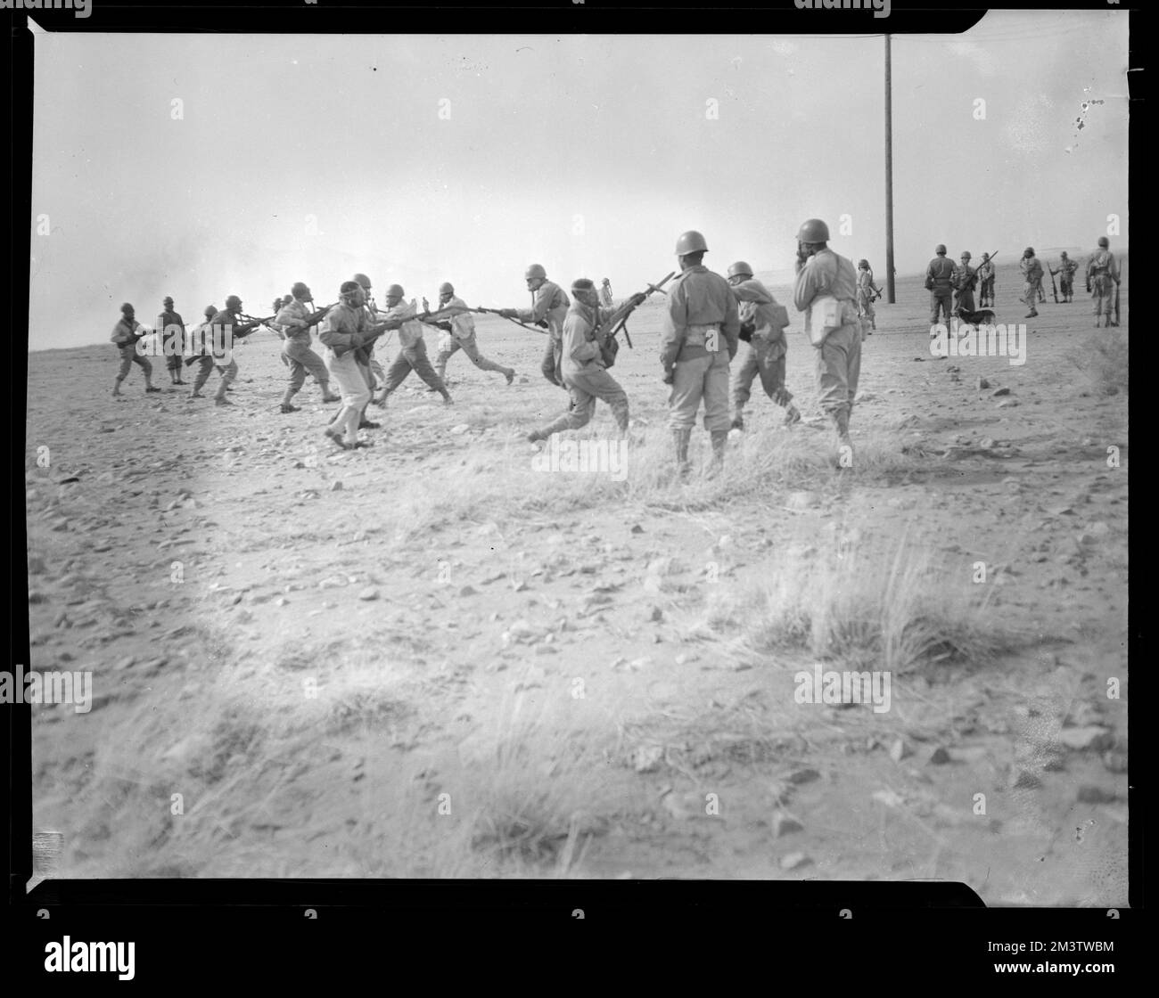 Soldiers wearing gas masks training with rifles and bayonets , Soldiers ...