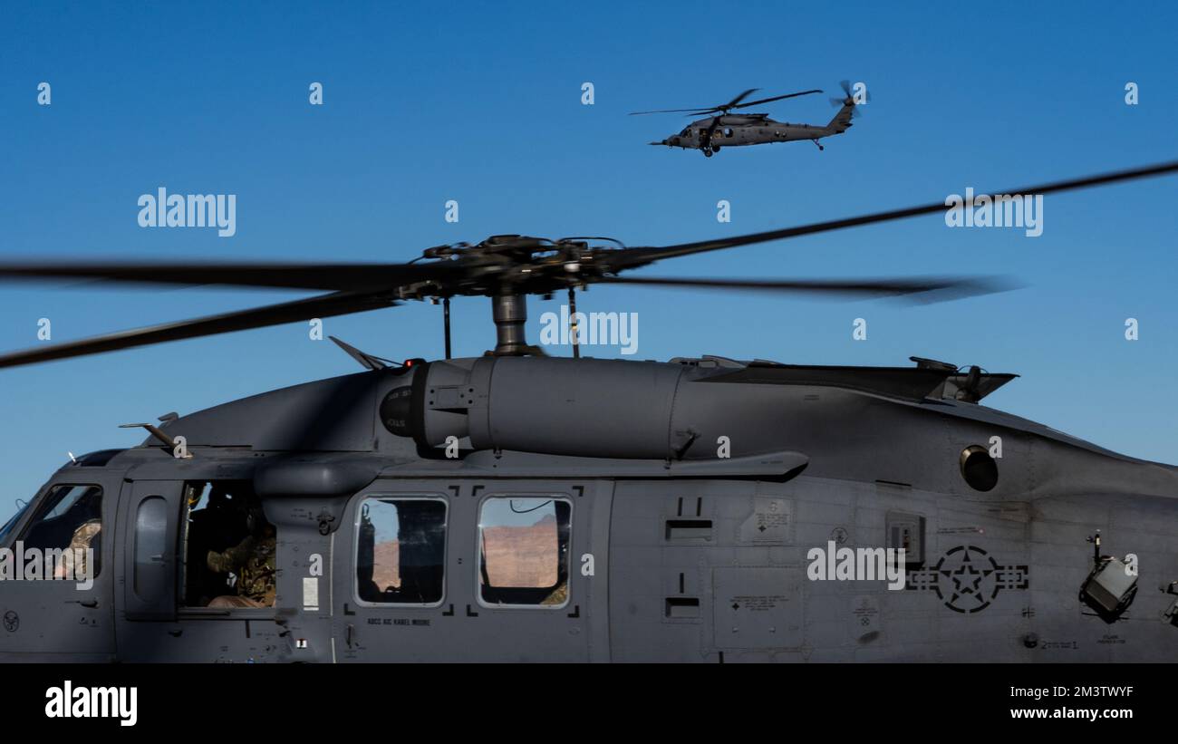 Two HH-60W helicopters assigned to the 66th Rescue Squadron conduct ...