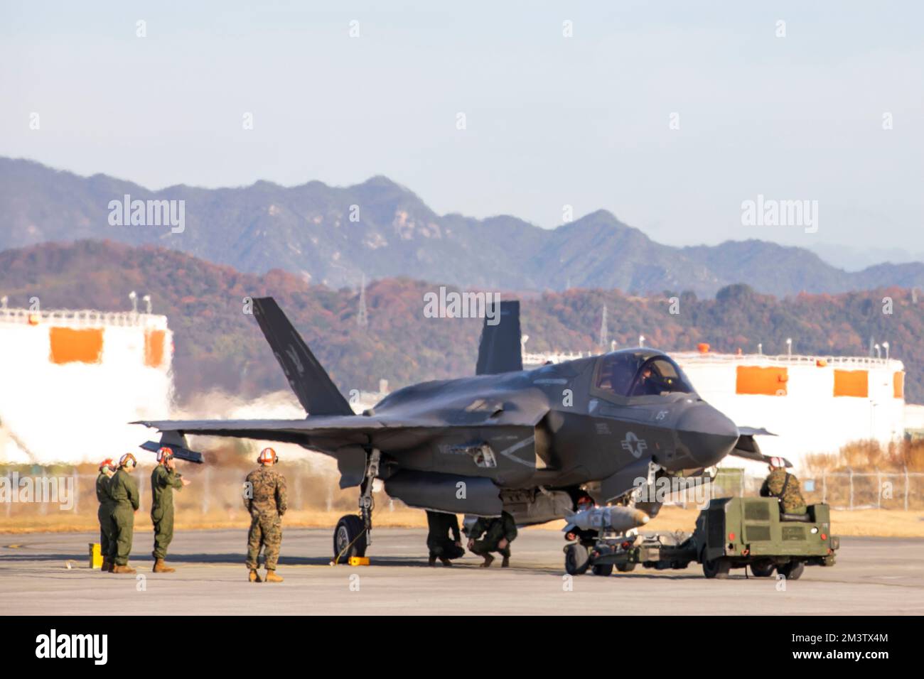 U.S. Marines with Marine Fighter Attack Squadron (VMFA) 242 load live ...