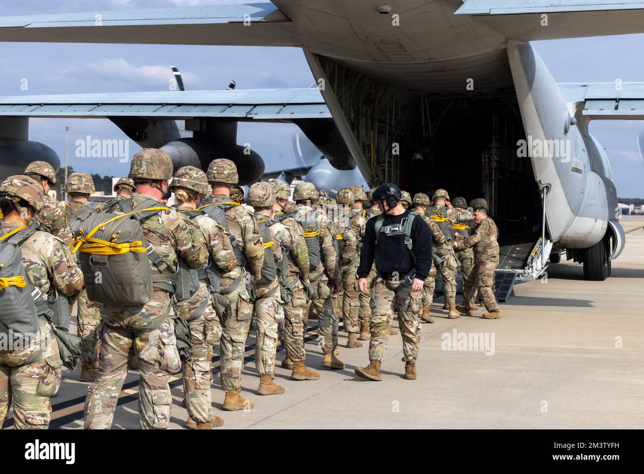 U.S. Soldiers board a KC-130J Hercules assigned to Marine Aerial ...