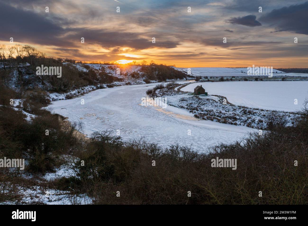 A frozen river, on the lower Tweed at Horncliffe looking across towards ...