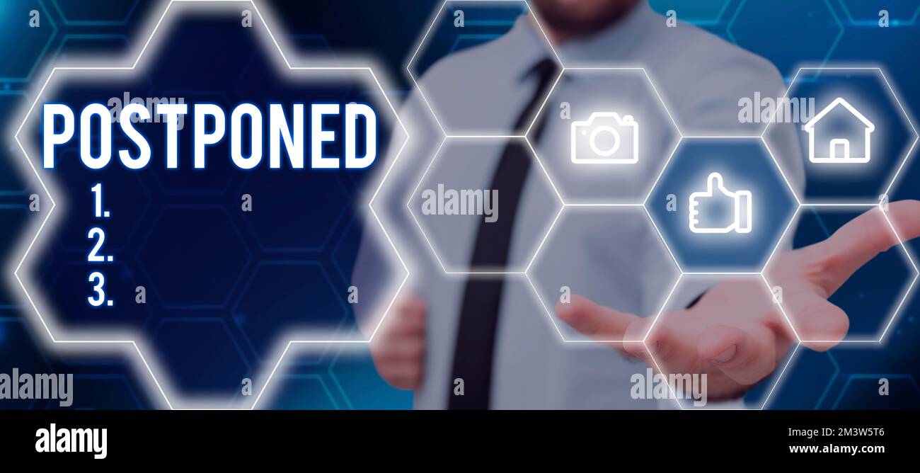 Inspiration showing sign Postponed. Word Written on to place later in ...