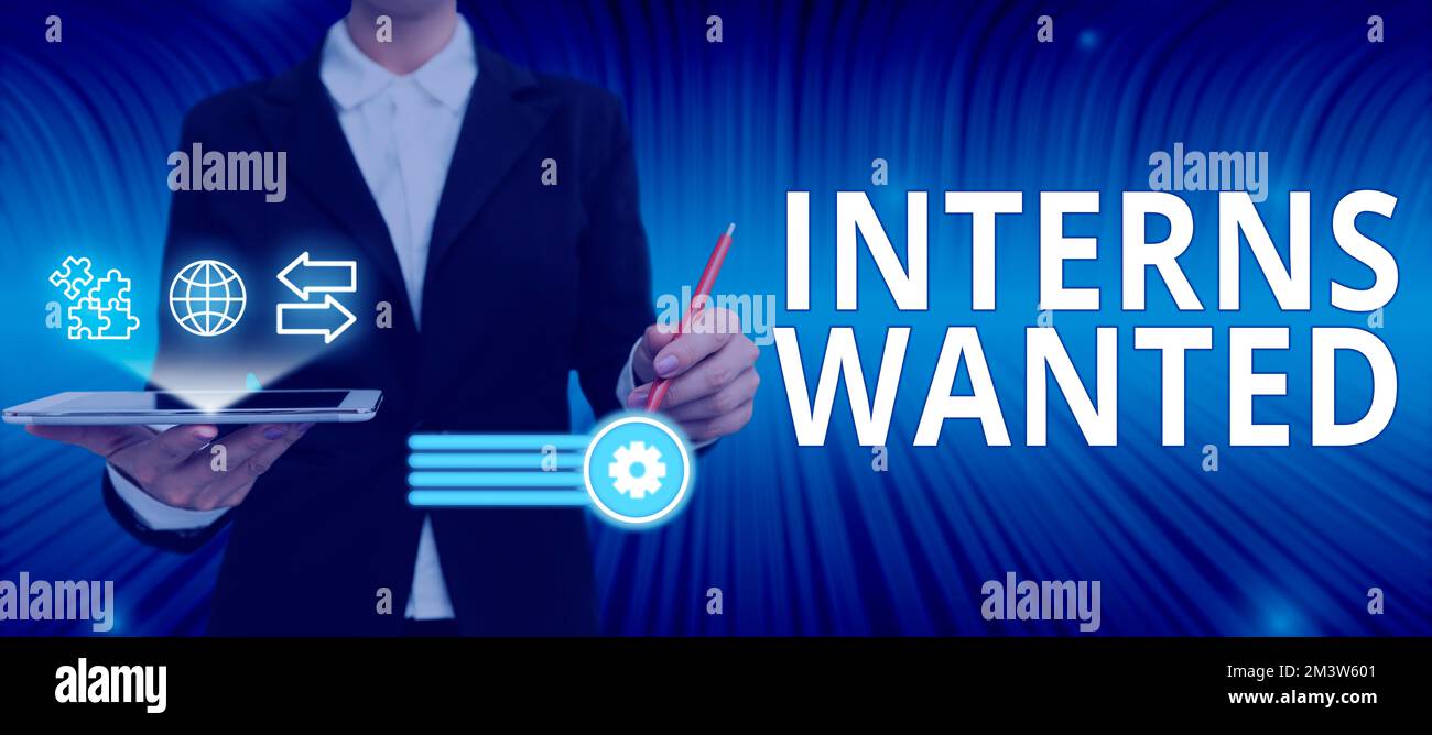 Sign displaying Interns Wanted, Word Written on Looking for on the job ...