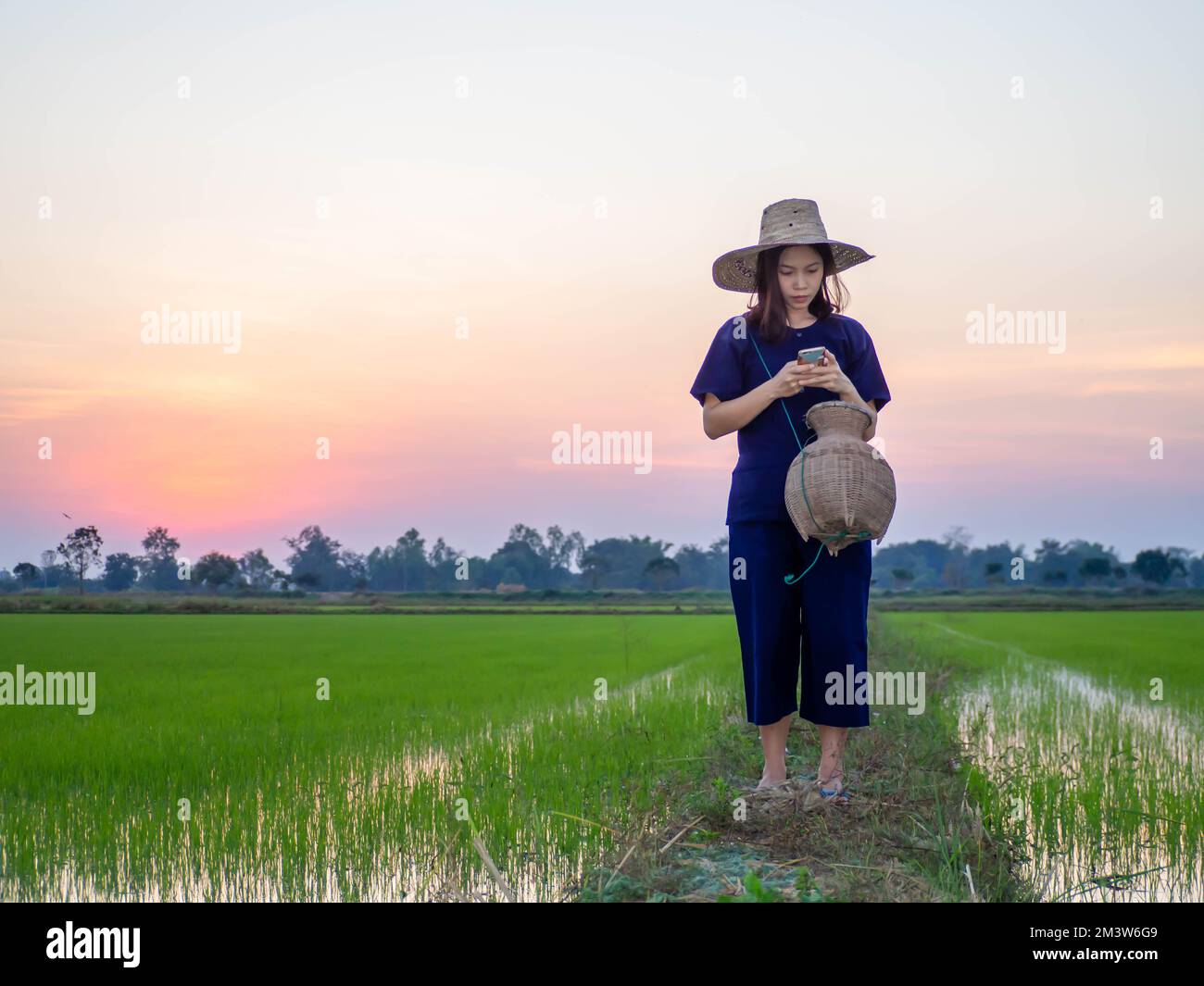 Young farmer wearing traditional Thai costumer Stock Photo - Alamy