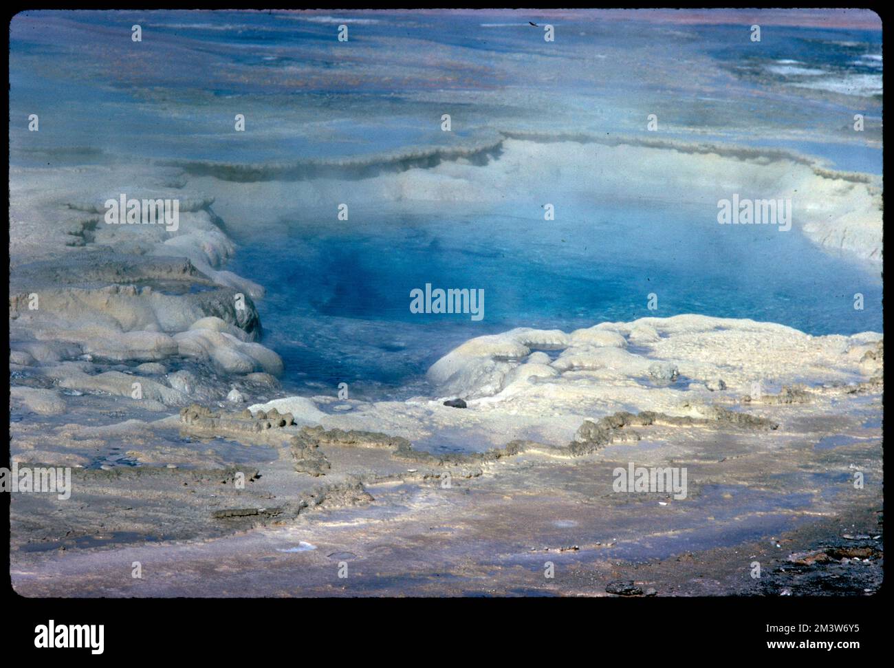 Steam rising from spring surrounded by gray-white rock , Springs ...