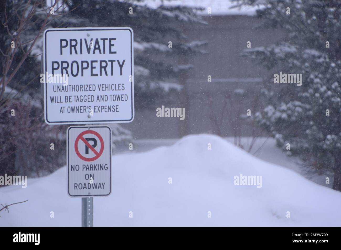No parking private property sign in winter snowstorm Stock Photo - Alamy