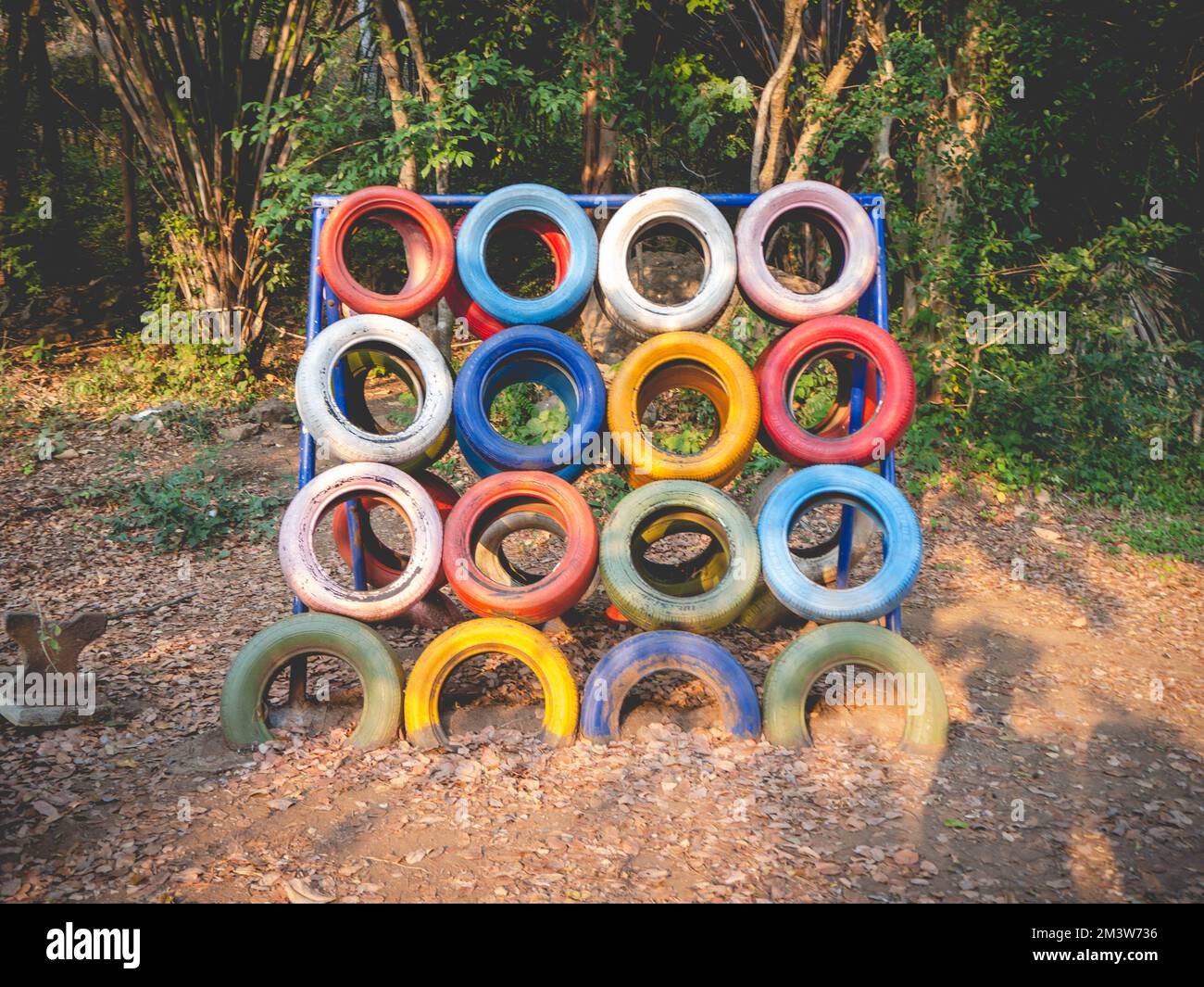 Painted wheels in the playground of Thailand Stock Photo - Alamy