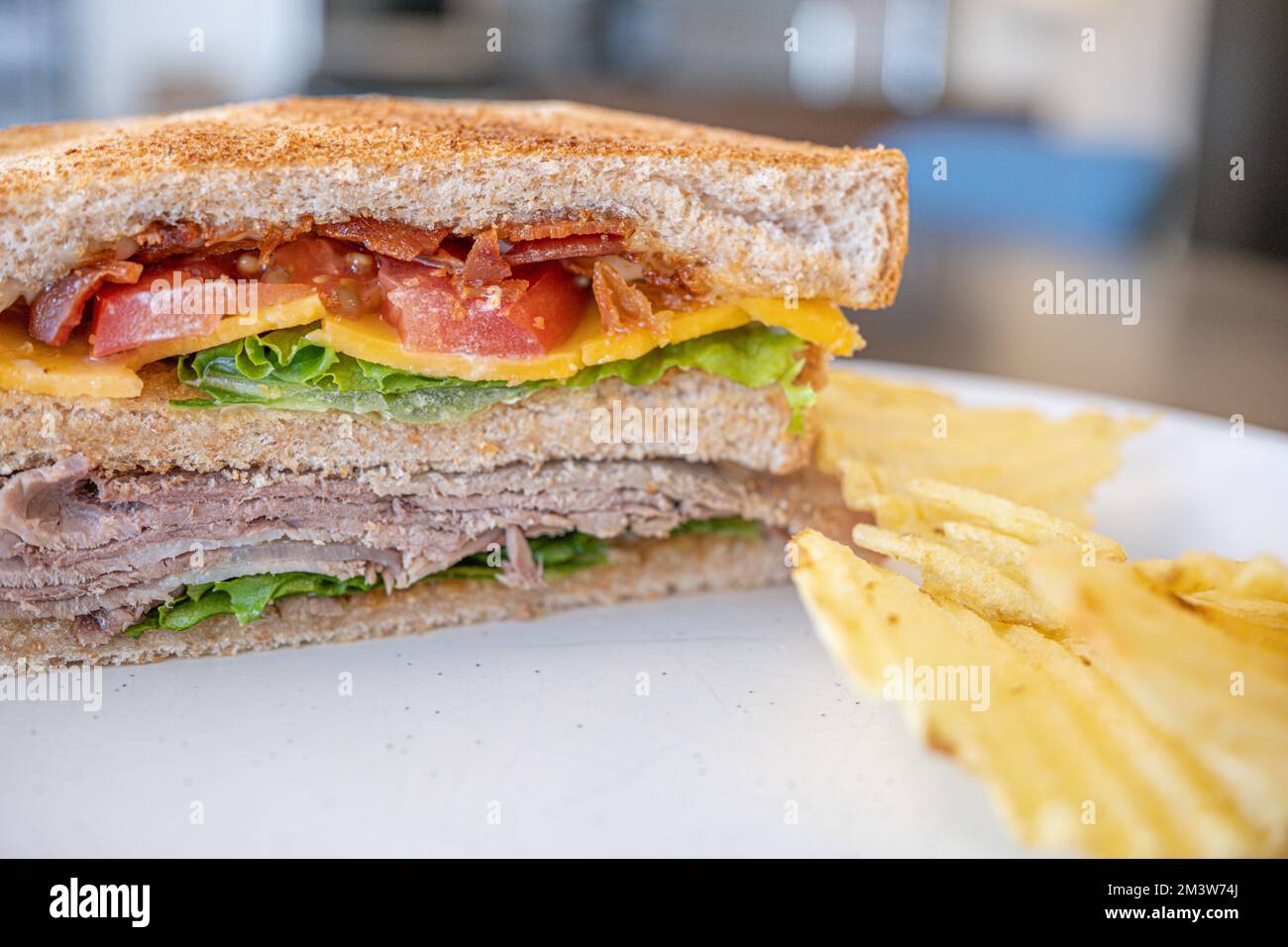 Toasted Texas Club Sandwitch ready to eat with crisps Stock Photo - Alamy