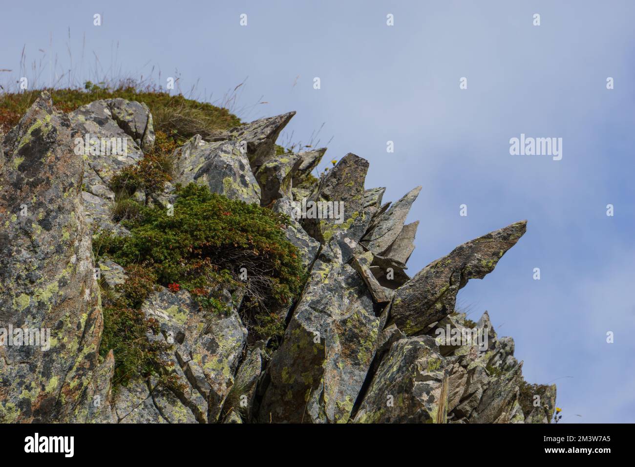 A detail of the geologic structure of the rock formation with sharp ...