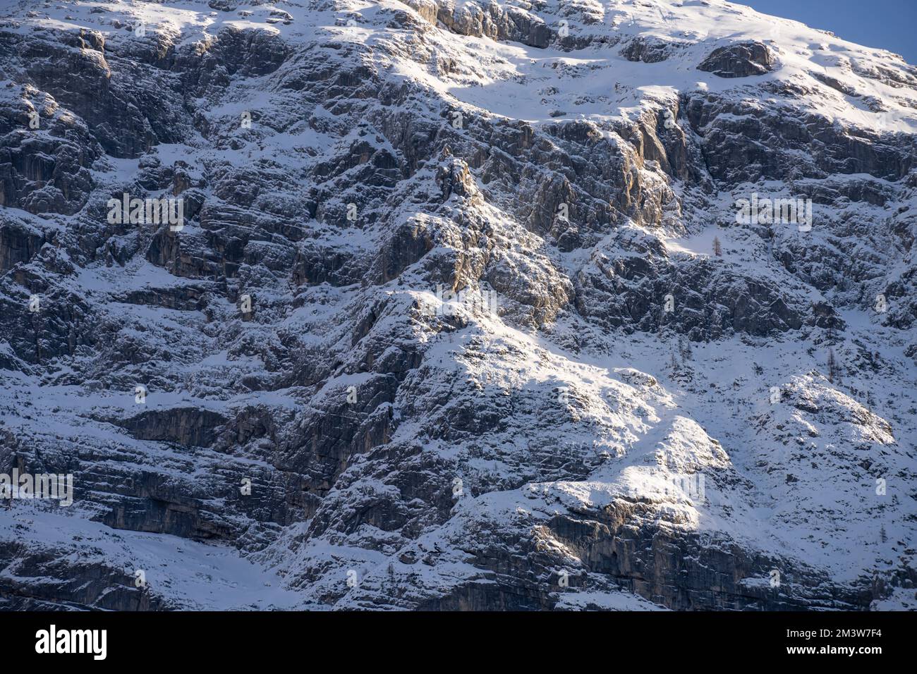 snow and ice deposited on the rock face of a mountain in winter Stock ...