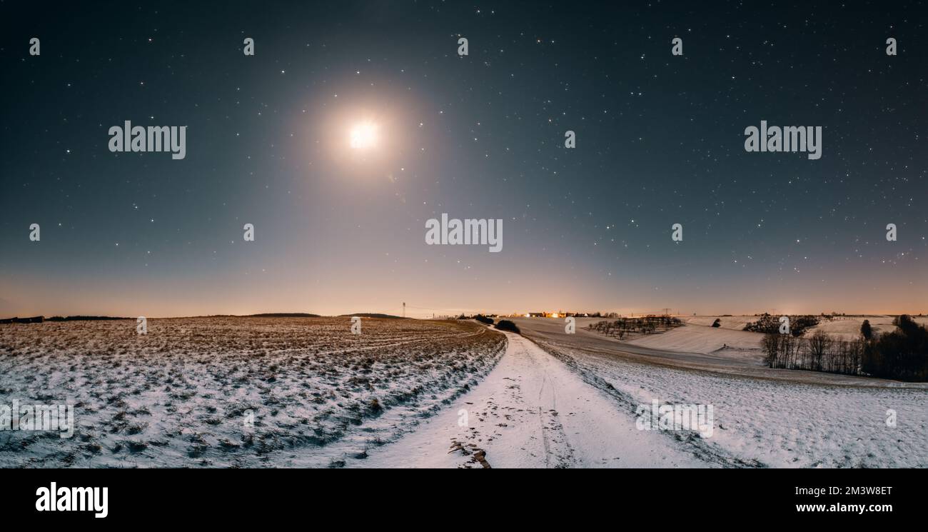 Snowy landscape at night Stock Photo - Alamy