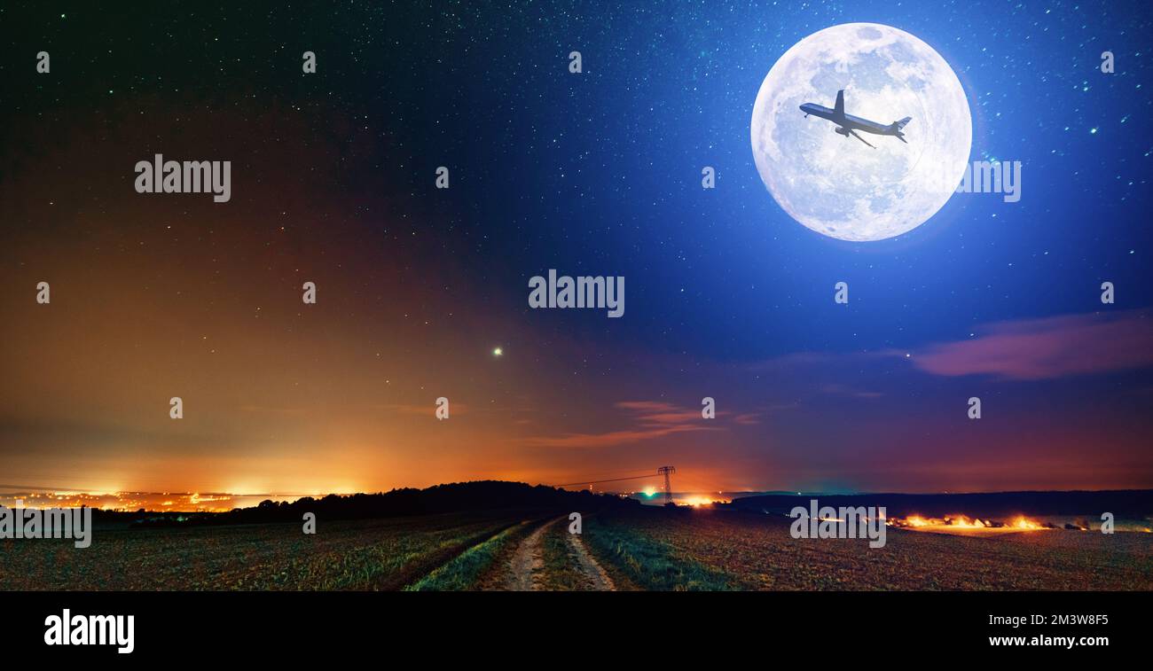 Plane in front of full Moon Stock Photo - Alamy