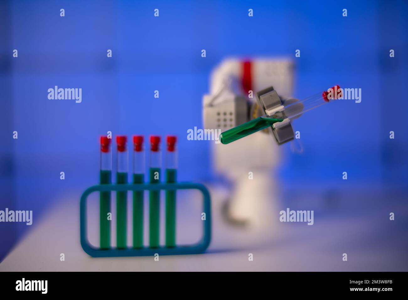 Robotic arm holding test tube Stock Photo - Alamy