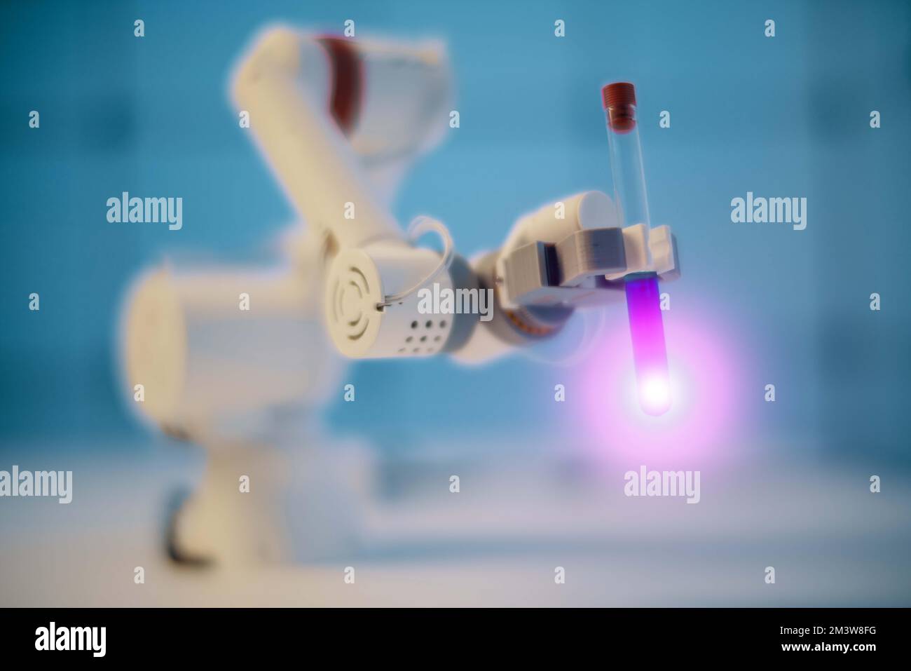 Robotic arm holding test tube Stock Photo - Alamy