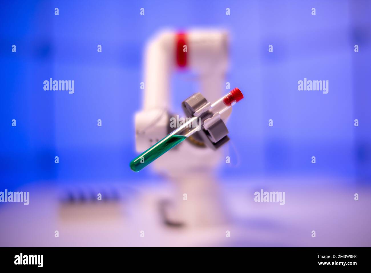 Robotic arm holding test tube Stock Photo - Alamy