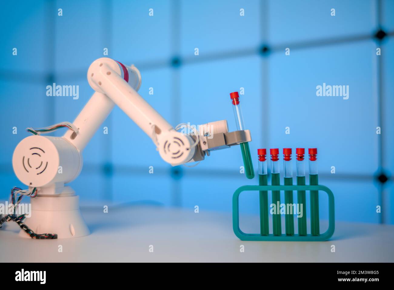 Robotic arm holding test tube Stock Photo - Alamy