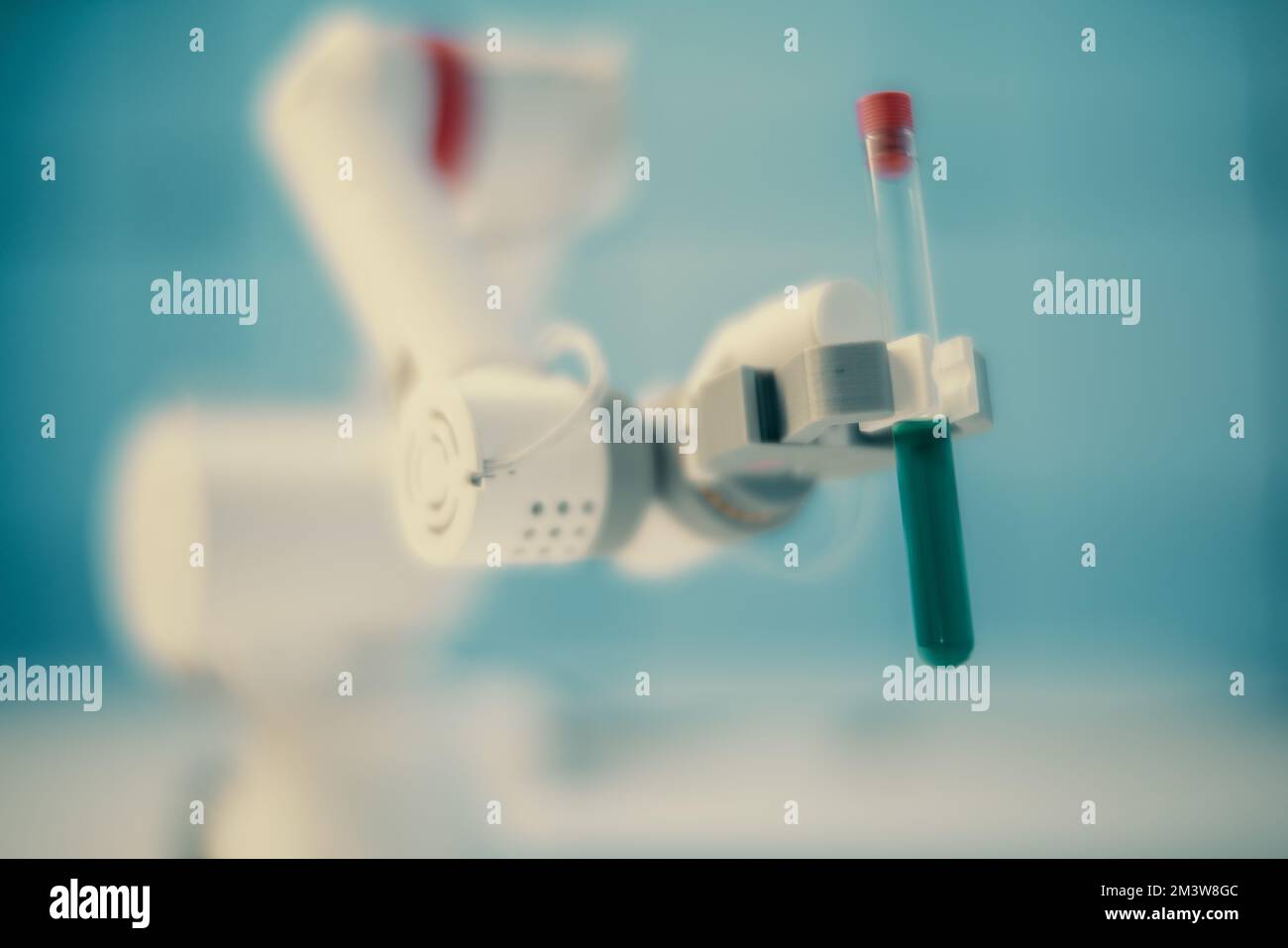 Robotic arm holding test tube Stock Photo - Alamy