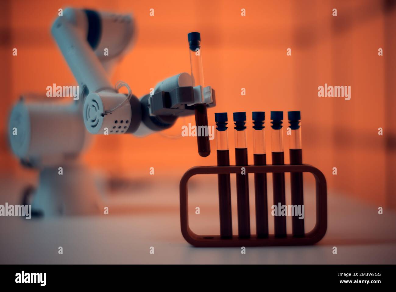 Robotic arm holding test tube Stock Photo - Alamy