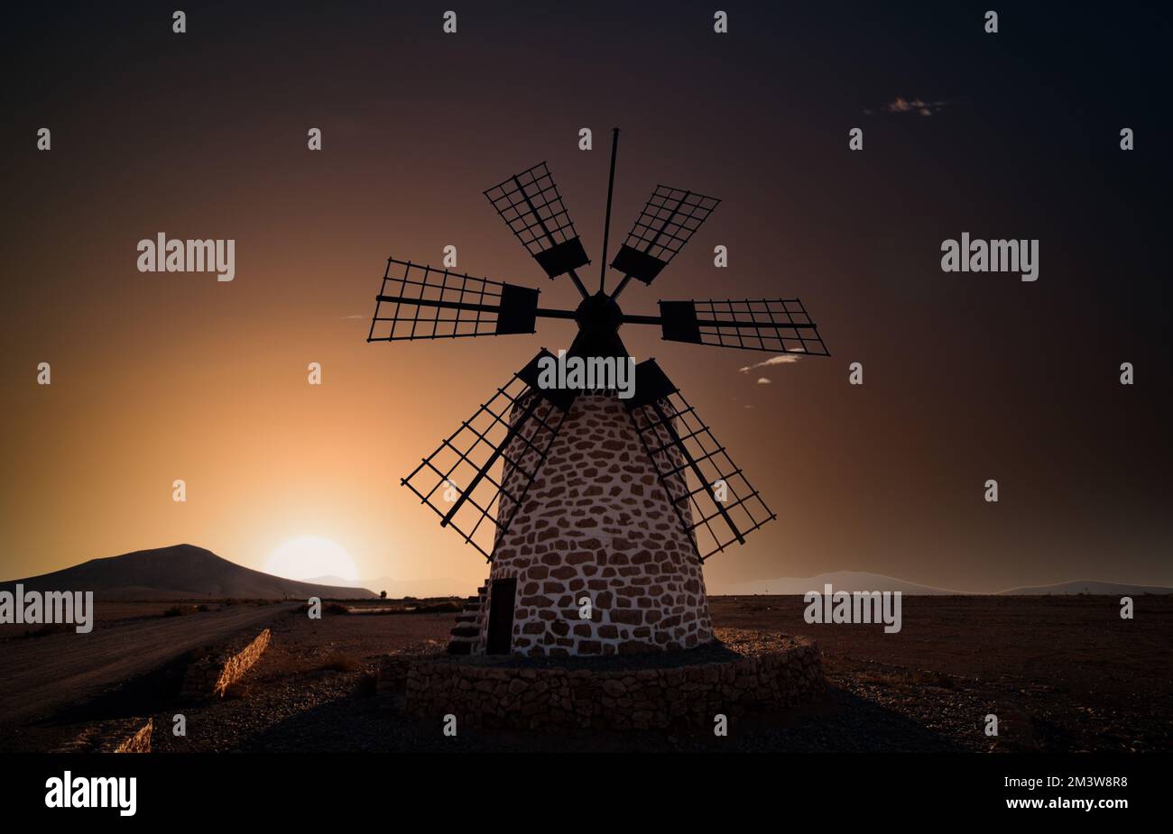 Windmill at sunset Stock Photo - Alamy