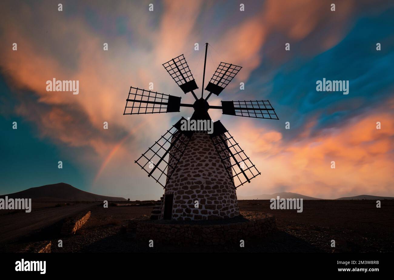Windmill at sunset Stock Photo - Alamy