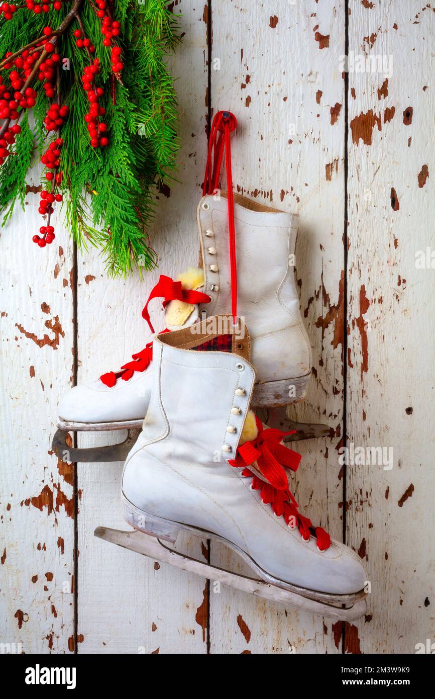 Ice Skates Hanging On White Wall Stock Photo - Alamy